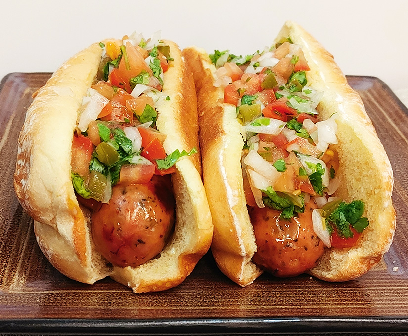 Mexican-style hot dogs with pico de gallo salsa and pickled jalapeños ...